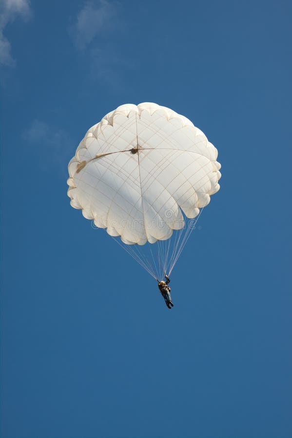 Round Parachute Against the Sunset Sky with Clouds in an Unusual Color ...