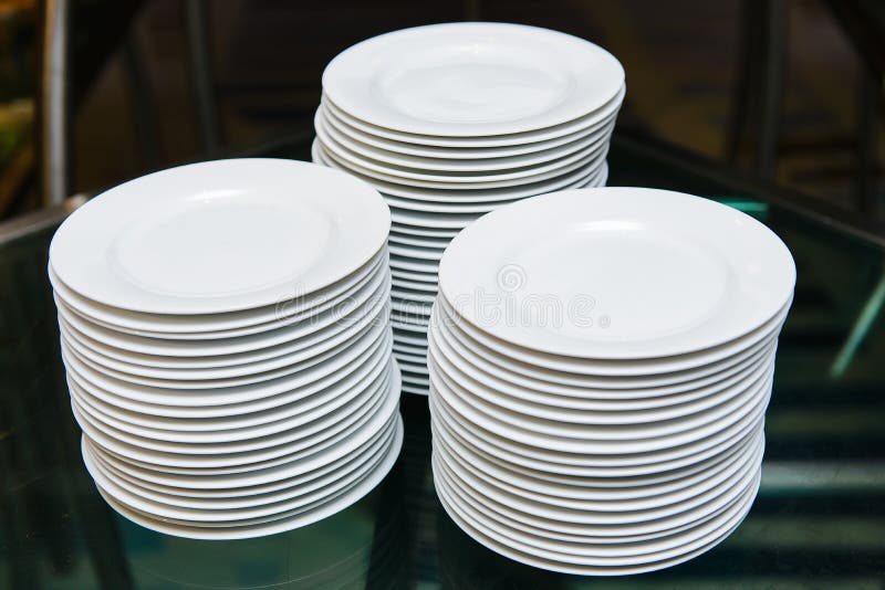 White round plates stock image. Image of pile, closeup - 90249981