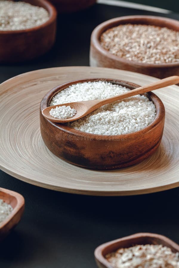 White Round Rice in a Wooden Bowl with Wooden or Bamboo Spoon Stock ...