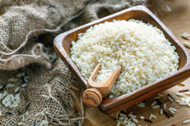 White Round Rice in a Wooden Bowl Close Up. Stock Image - Image of ...