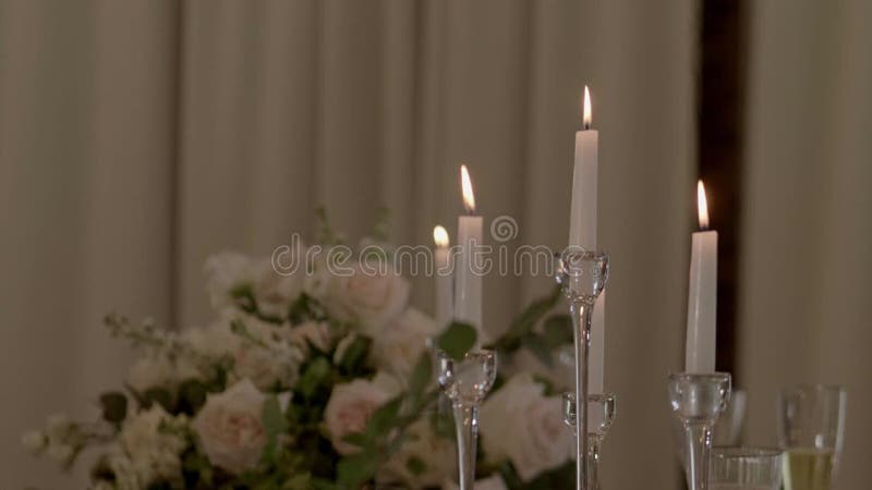White Round Rough Candles Stand on Candlesticks on the Table and Burn ...