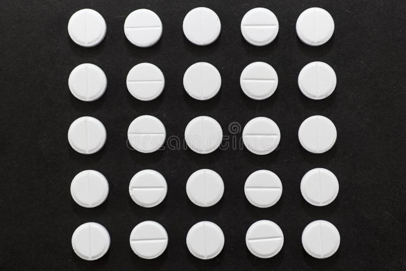 White Round Tablets in the Shape of a Square on a Dark Background Stock ...