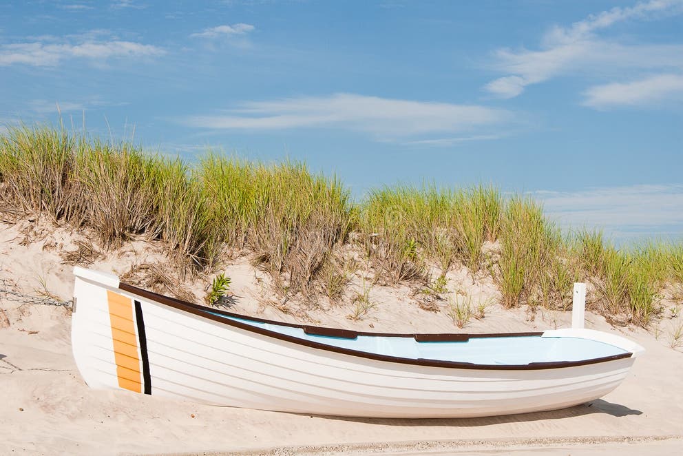 White Rowboat on Sandy Dune Stock Photo - Image of lifesaving, scenery ...