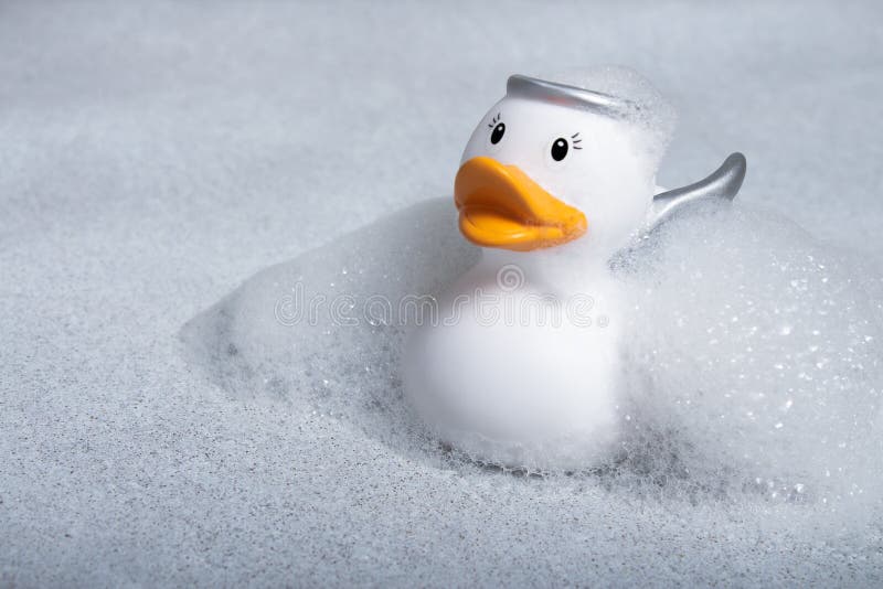 White Rubber Duck for a Bath in the Form of an Angel on a Light ...