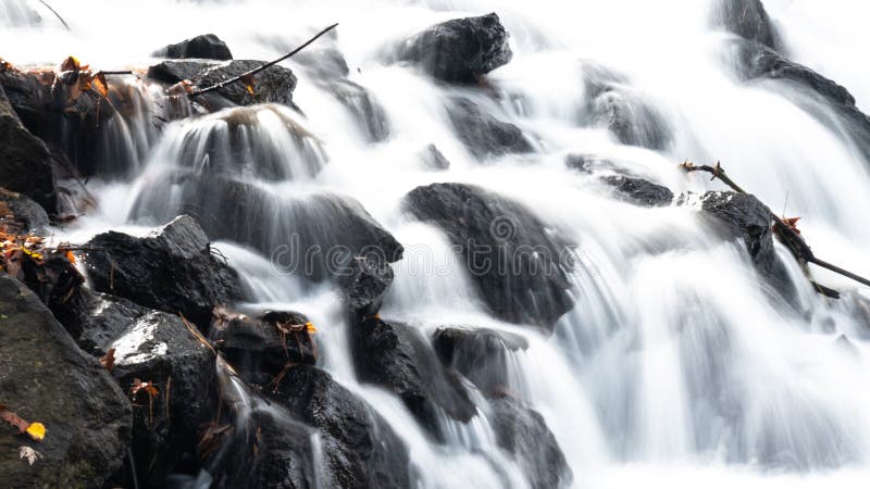 White Rushing Water Flowing Over Exposed Jagged Rocks Stock Image ...