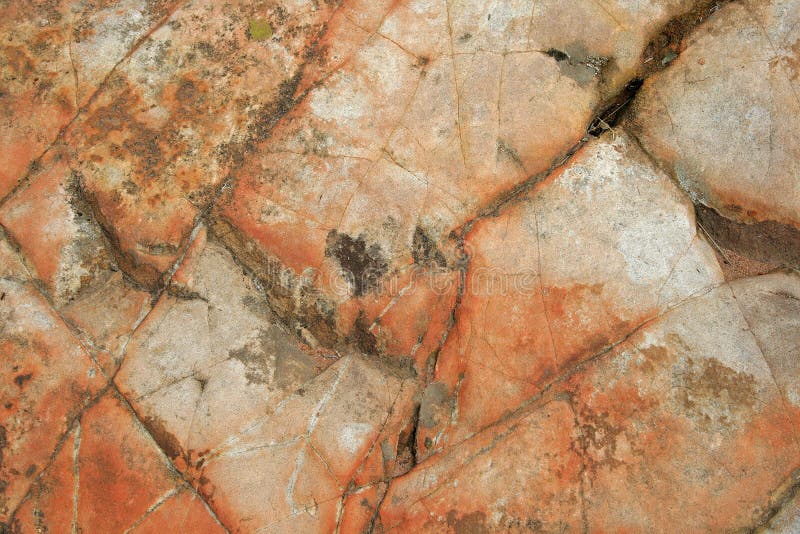 White and Rust Coloured Rocks Partitioned into Sections by Cracks Stock ...