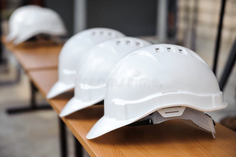 White safety hat stock image. Image of construction, blurred - 77010311