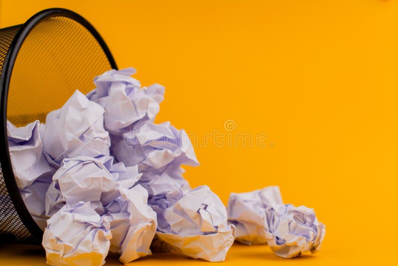 White Scraps of Paper in the Trash Can on a Yellow Background, Waste ...