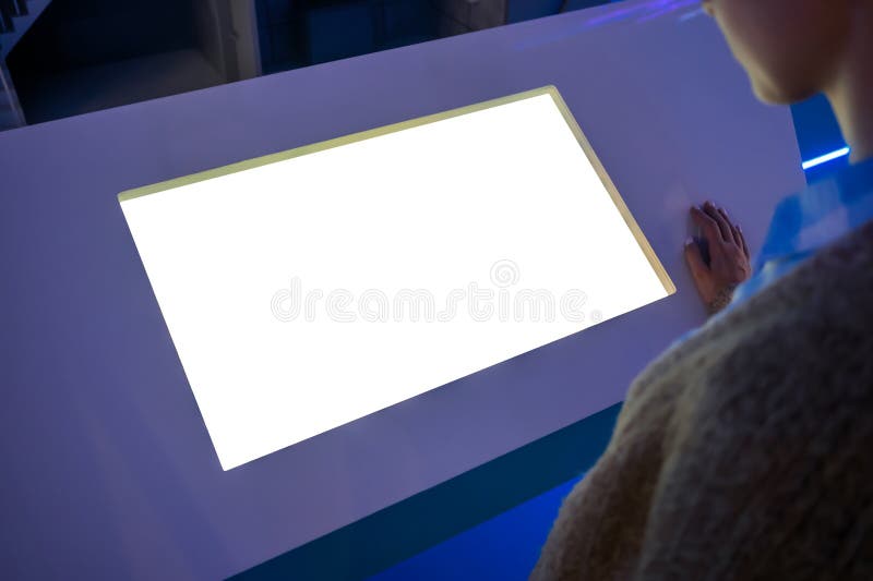 White Screen Concept - Woman Looking at Blank White Display Kiosk at ...