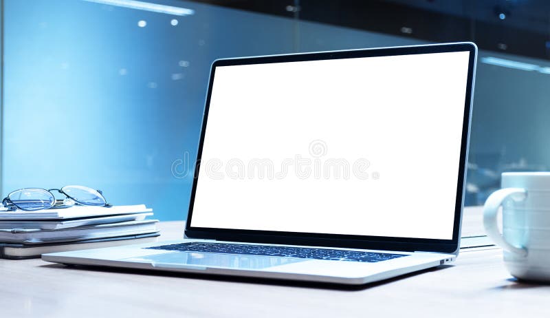 White Screen on Display Laptop with Notebook and Glasses on Table in ...
