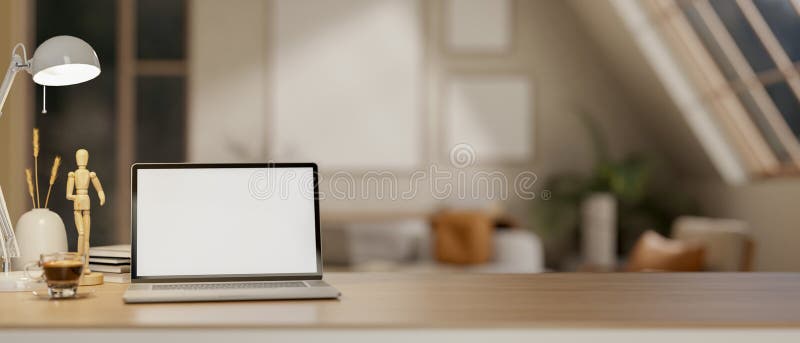 A White Screen Laptop on Wooden Table Under the Lamp Light and Moon ...