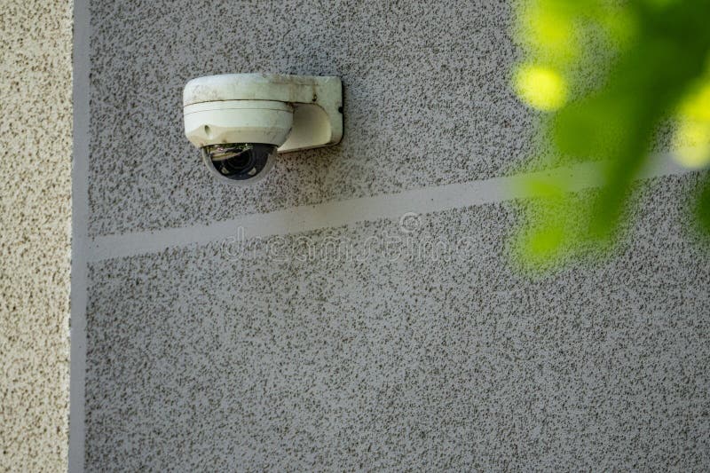 White Security Camera Mounted on Exterior Wall of Building Stock Photo ...