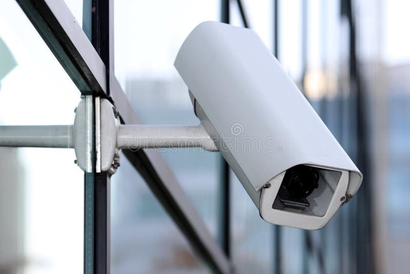 White Security Cctv Camera on Glass Facade Stock Photo - Image of ...