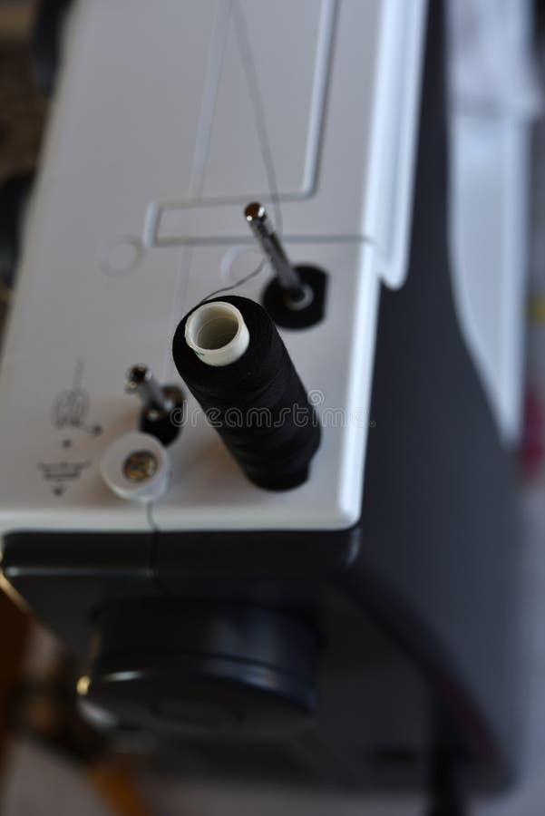 A White Sewing Machine in the Room. Processing of Clothes with a Sewing ...