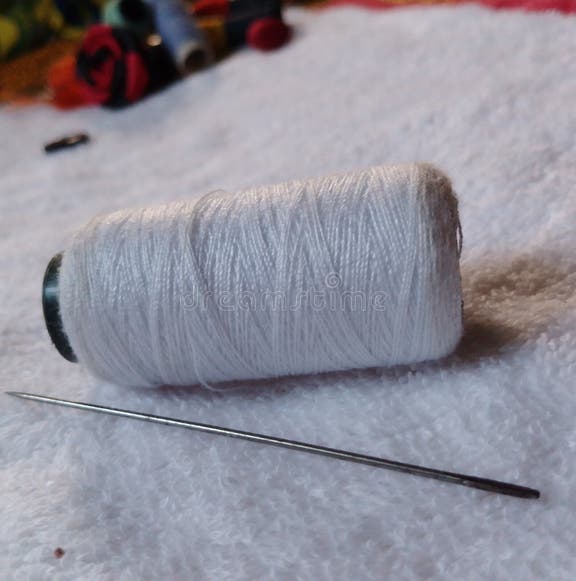 A White Sewing Thread and Needle Stock Image - Image of white, thread ...
