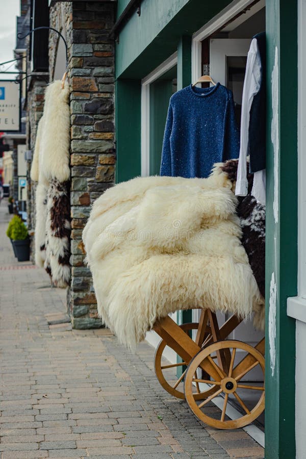 White Sheep Fleece on a Cart in Front of a Store Stock Photo - Image of ...