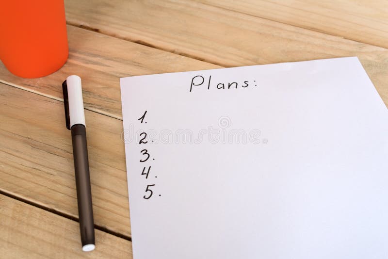 White Sheet of Paper with Written Plan and Points. Pen, Wooden Table ...