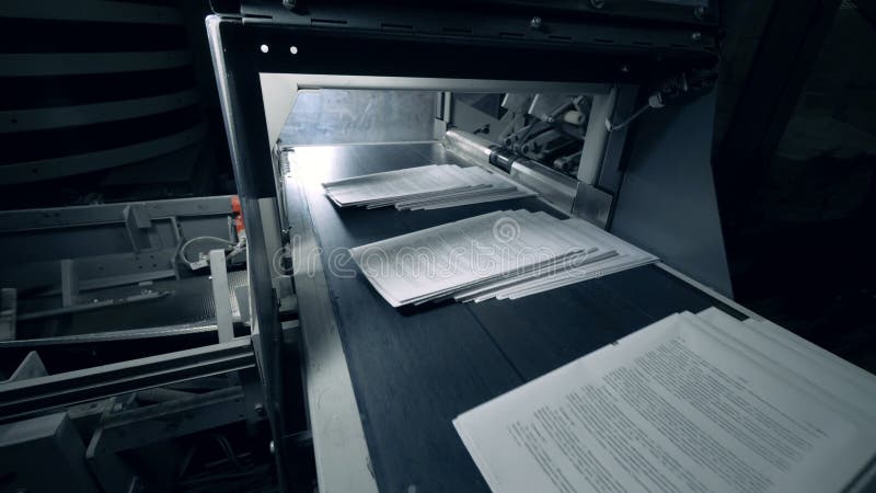 White Sheets of Paper Moving on a Typographic Conveyor, Automated ...