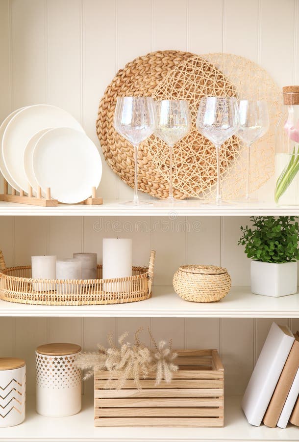 White Shelving Unit with Dishware and Decorative Stuff Stock Photo ...