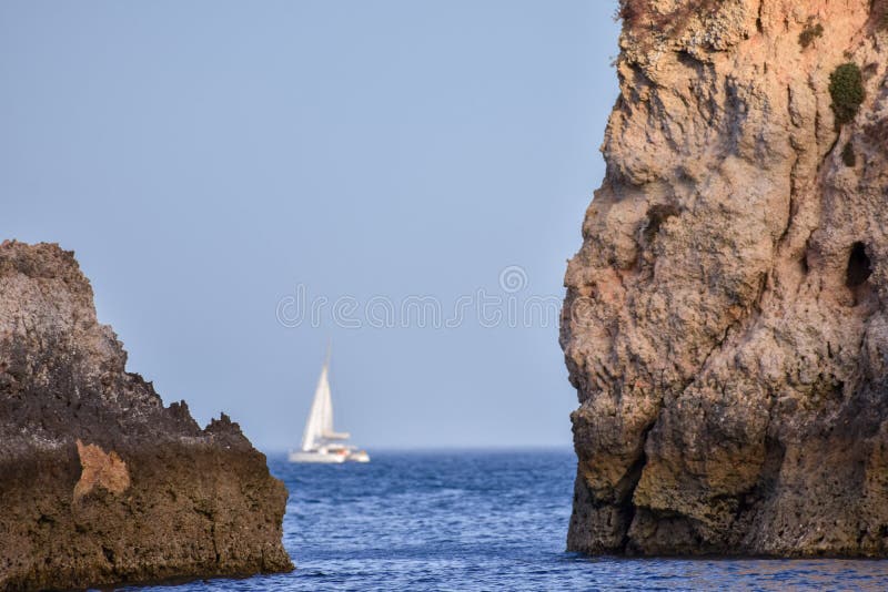 White Ship Seen between the Cliffs of the Ocean Stock Photo - Image of ...