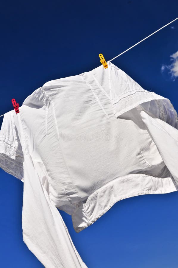 White Shirt on Clothes Line Stock Photo - Image of clips, hang: 10868508