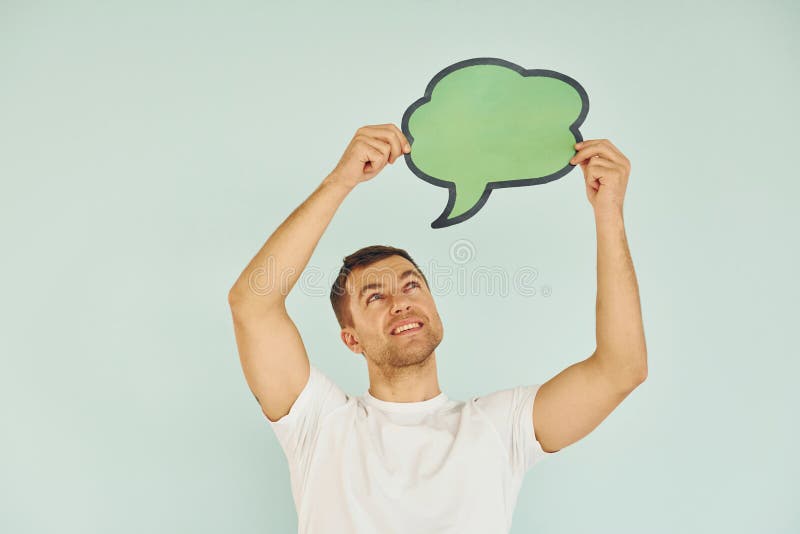 In White Shirt. Man Standing in the Studio with Empty Signs for the ...