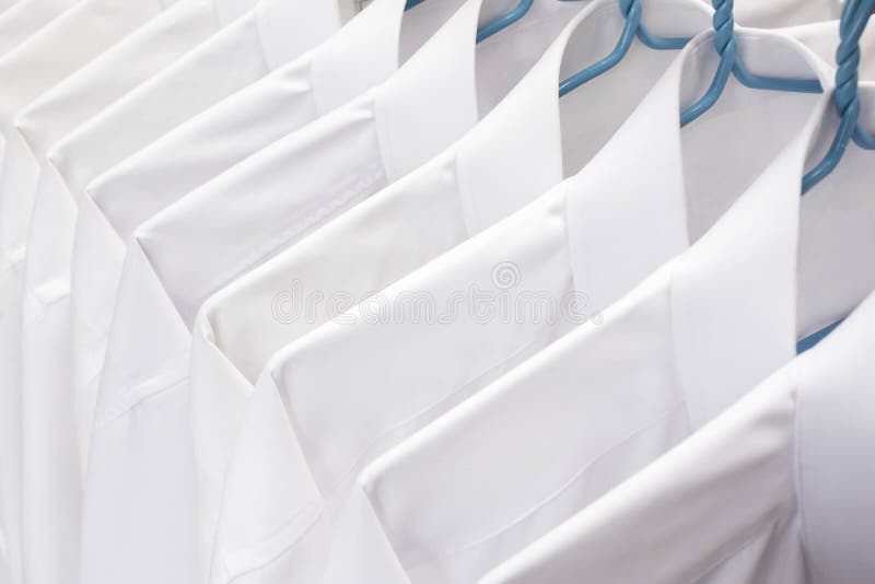 Men Shirts Hanging on Rack in a Row, Top View Stock Photo - Image of ...