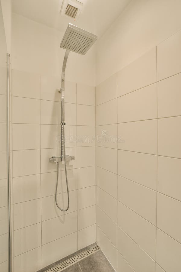 A White Shower in a White Tiled Bathroom Stock Image - Image of tiles ...