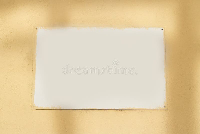 White Sign Board on Wall stock photo. Image of symbol - 49646750