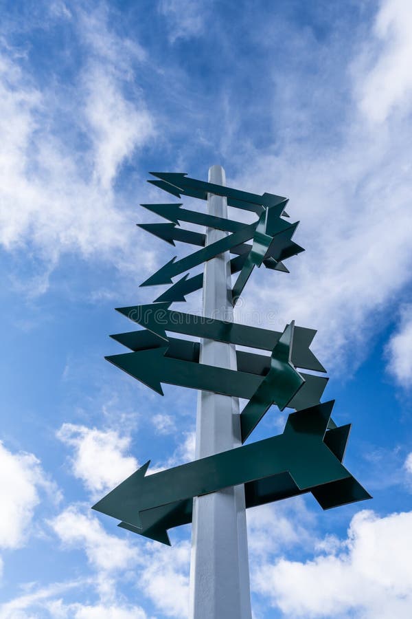 White Sign Post with Many Dark Green Blank Arrows Stock Photo - Image ...