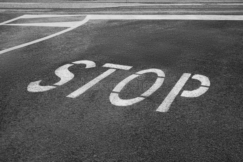 White Sign STOP Written on Asphalt Road Stock Photo - Image of message ...