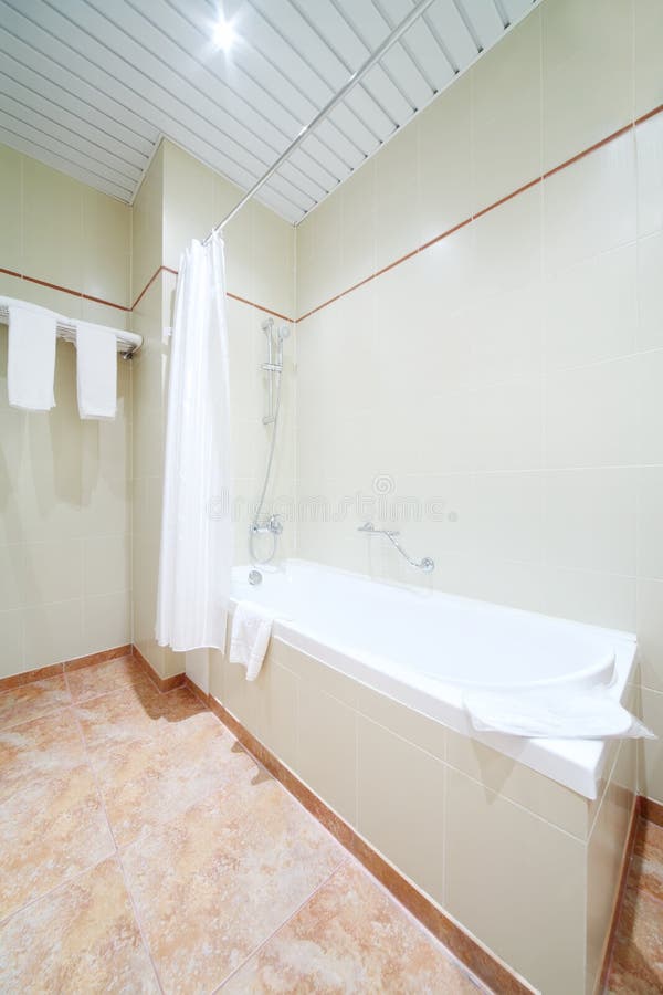 Light And Clean Bathroom With Toilet With Tiles On Floor Stock Image ...