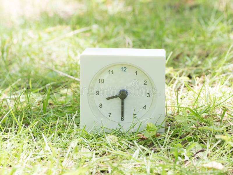 White Simple Clock on Lawn Yard, 7:35 Seven Thirty Five Stock Photo ...
