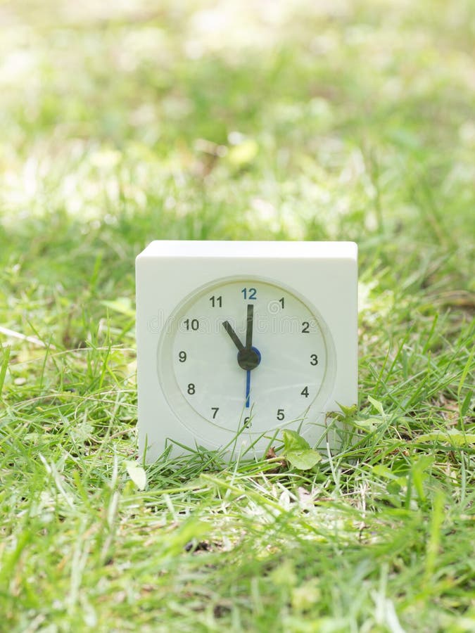 White Simple Clock on Lawn Yard, 11:00 Eleven O`clock Stock Photo ...