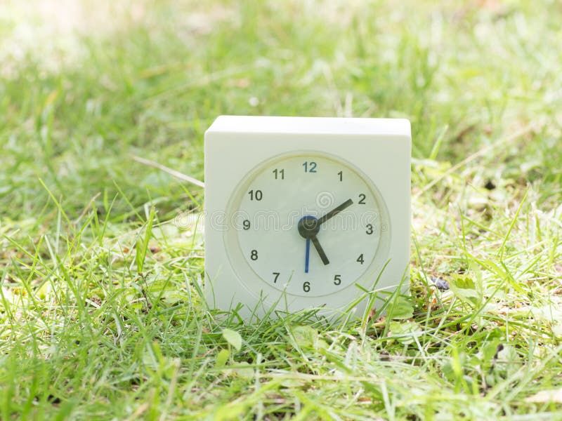 White Simple Clock on Lawn Yard, 5:10 Five Ten Stock Photo - Image of ...