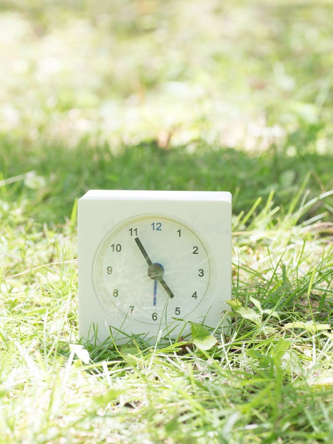 White Simple Clock on Lawn Yard, 4:55 Four Fifty Five Stock Image ...