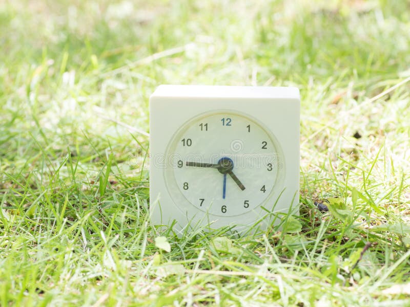 White Simple Clock on Lawn Yard, 4:45 Four Forty Five Stock Image ...