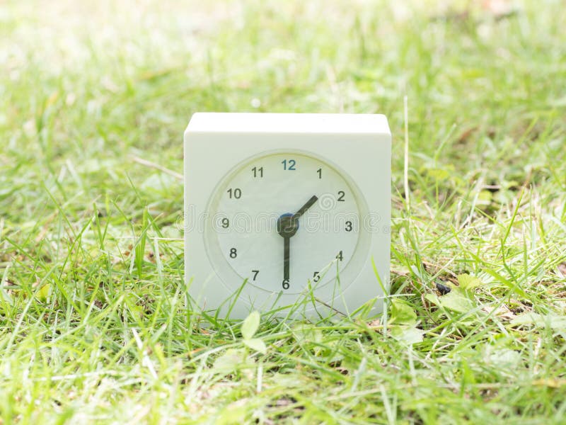 White Simple Clock on Lawn Yard, 1:30 One Thirty Half Stock Photo ...
