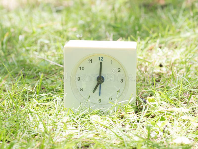 White Simple Clock on Lawn Yard, 7:00 Seven O`clock Stock Photo - Image ...