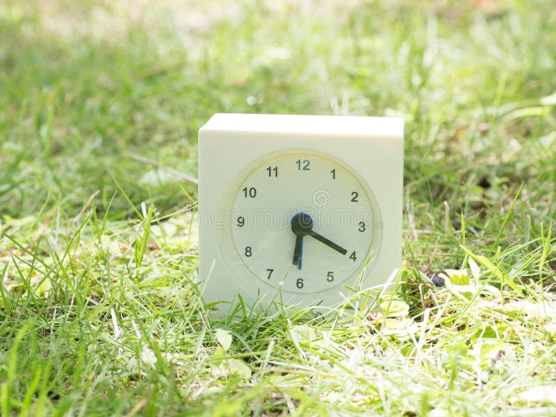 White Simple Clock on Lawn Yard, 6:20 Six Twenty Stock Image - Image of ...