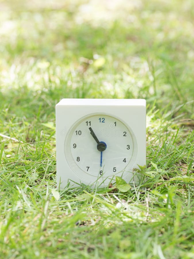 White Simple Clock on Lawn Yard, 10:55 Ten Fifty Five Stock Image ...