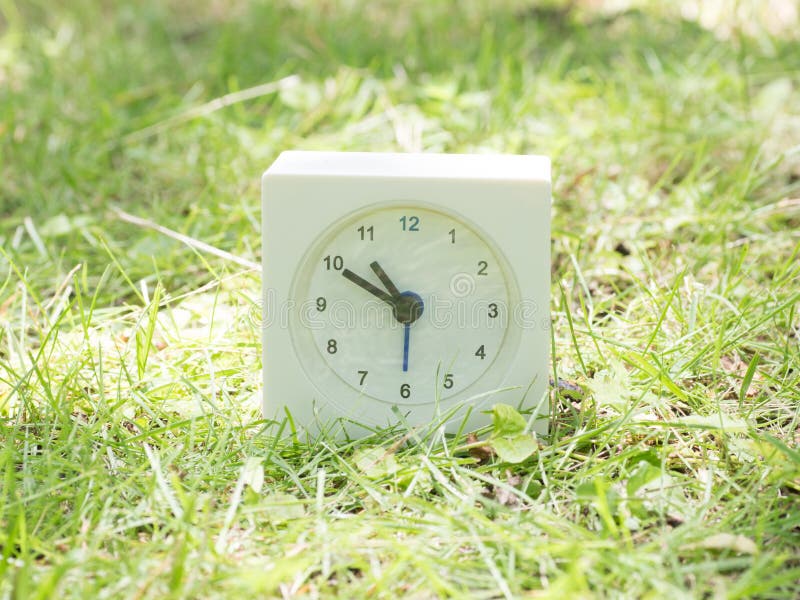 White Simple Clock on Lawn Yard, 10:50 Ten Fifty Stock Photo - Image of ...