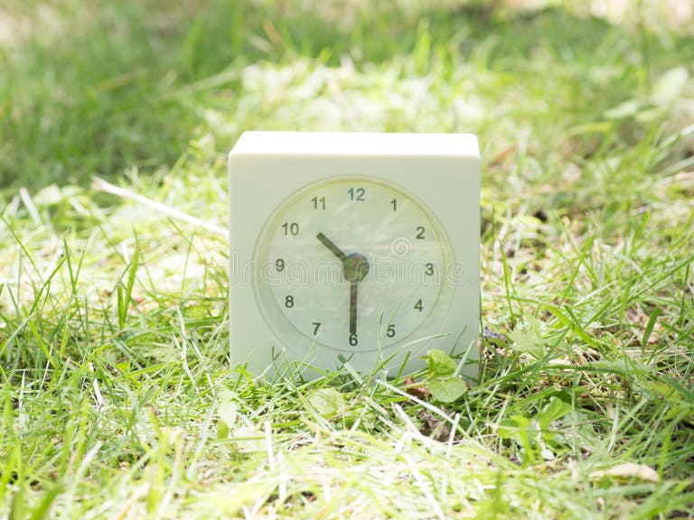 White Simple Clock on Lawn Yard, 10:30 Ten Thirty Half Stock Image ...