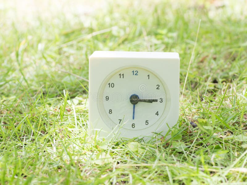 White Simple Clock on Lawn Yard, 3:15 Three Fifteen Stock Photo - Image ...