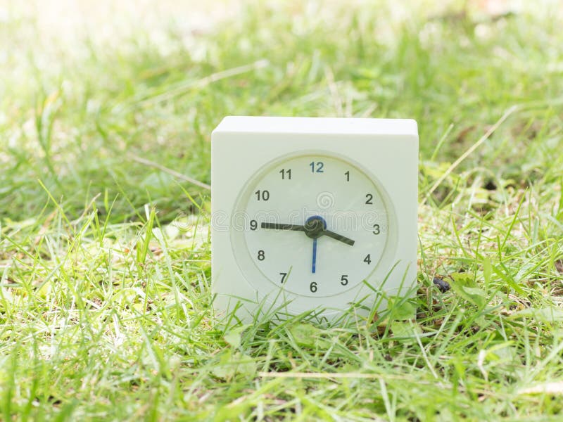 White Simple Clock on Lawn Yard, 3:45 Three Forty Five Stock Photo ... White Simple Clock on Lawn Yard, 3:45 Three Forty Five Stock Photo ...