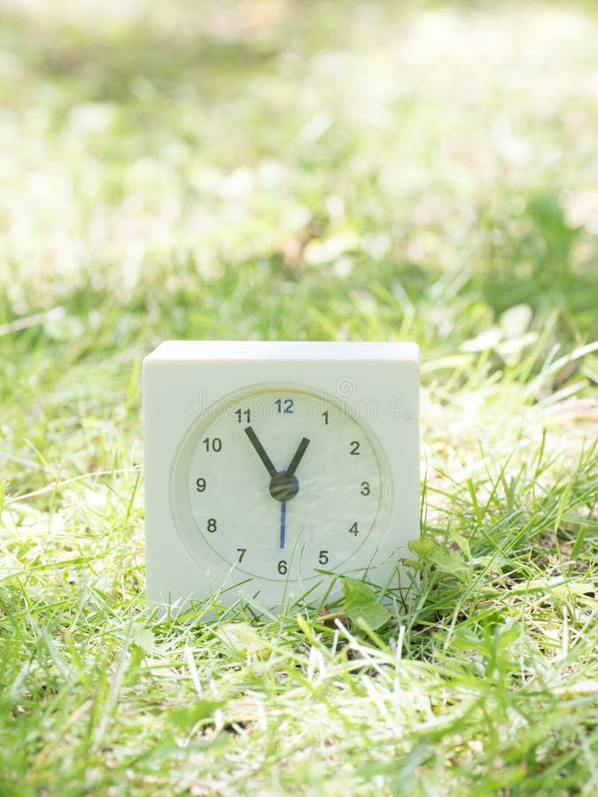 White Simple Clock on Lawn Yard, 12:55 Twelve Fifty Five Stock Photo ...