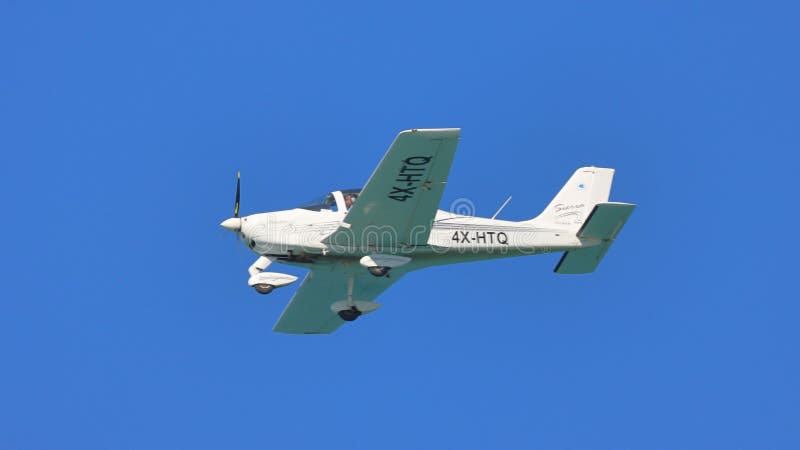 White Plane Flies in the Blue Sky. Editorial Stock Photo - Image of ...