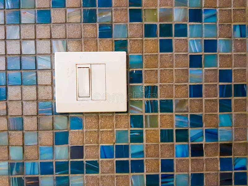 White Single Plastic Switch on a Tiled Wall Design Stock Image - Image ...