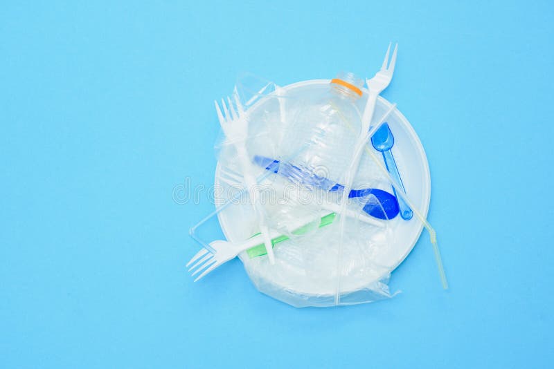 White Single-use Plastic and Other Plastic Items on a Blue Background ...