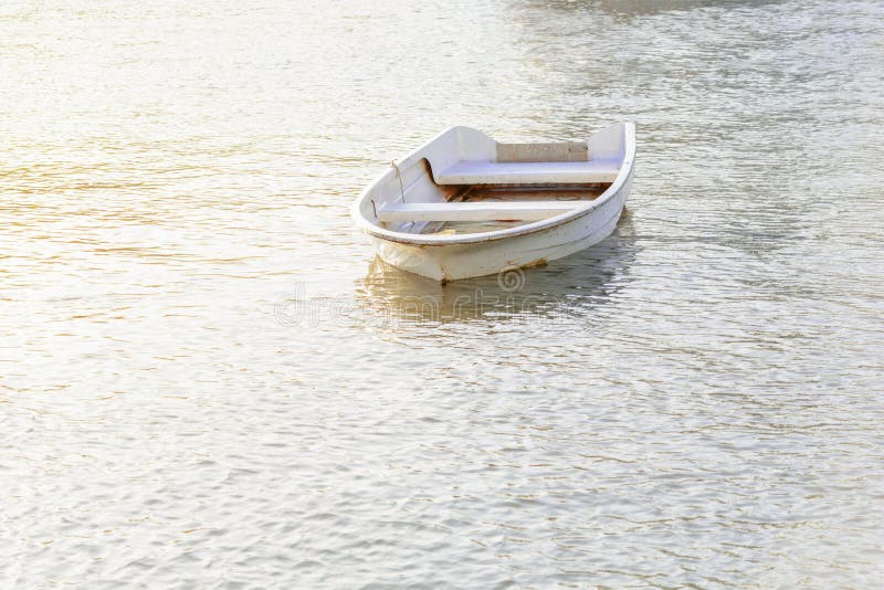 White Small Old Fishing Boat on River with Sun on the Side Stock Photo ...